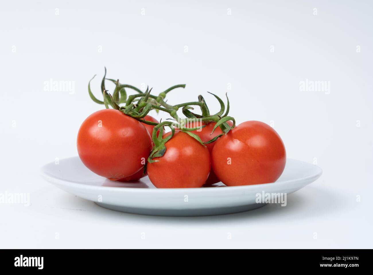 Image of tomato clusters Stock Photo - Alamy