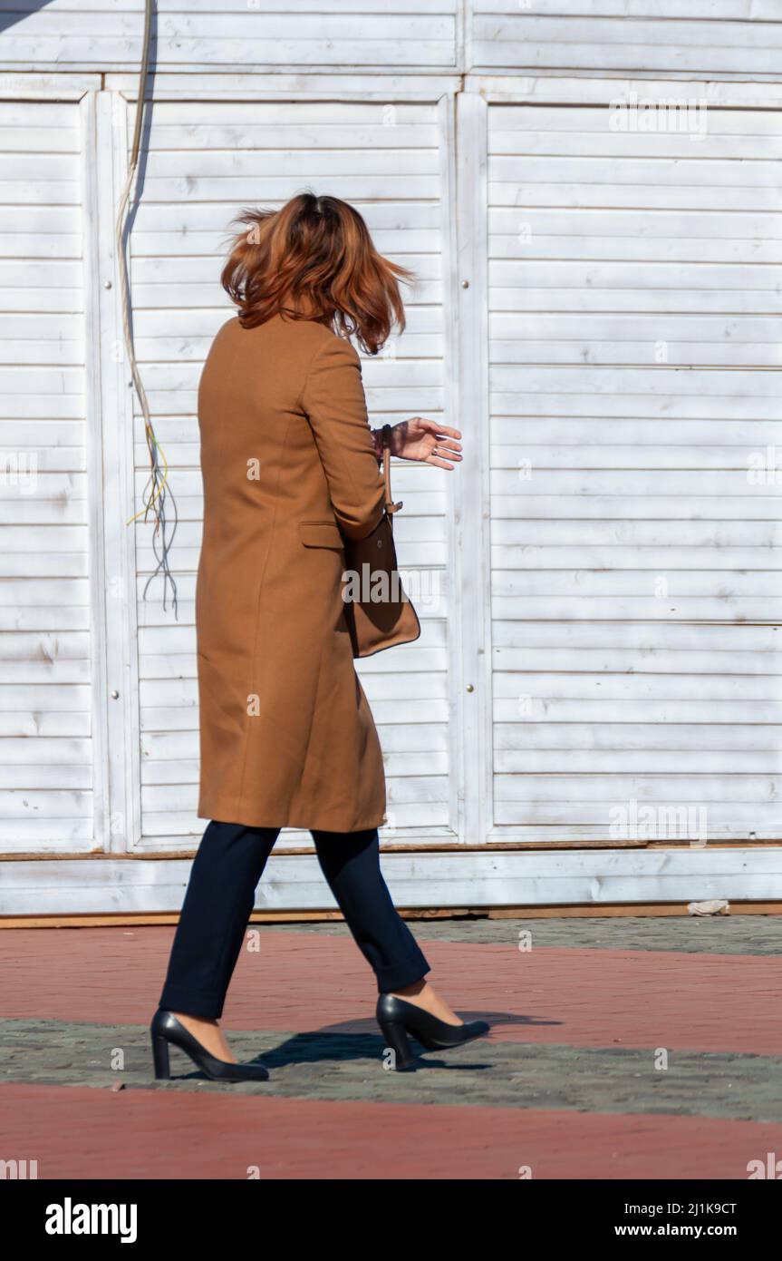 Woman walking on the street. Real people Stock Photo - Alamy