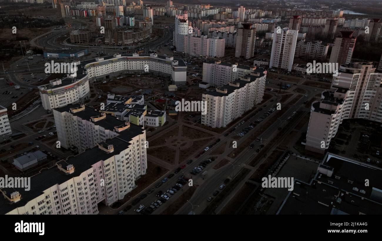 City block. Modern multi-storey buildings. Flying at dusk at sunset ...