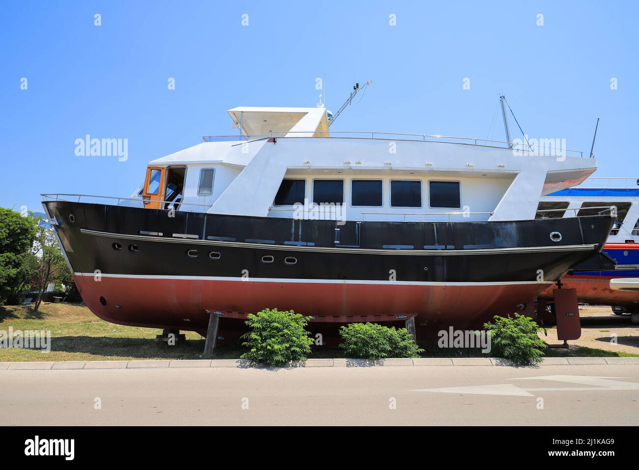 Old motor boat under repair on the shore in the dock Stock Photo - Alamy