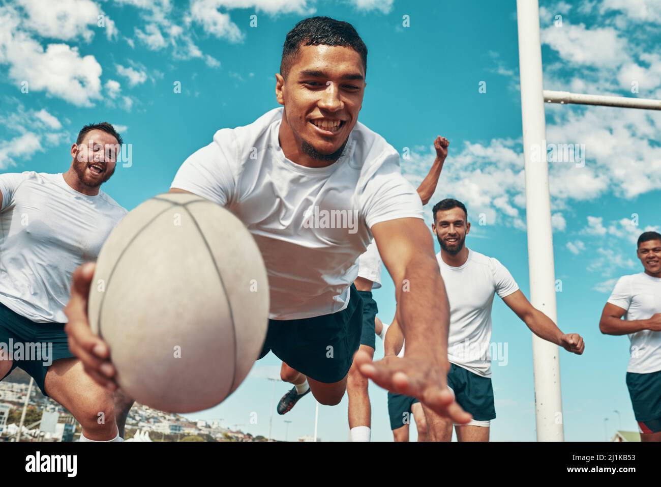 Young rugby player scoring a try hi-res stock photography and images ...