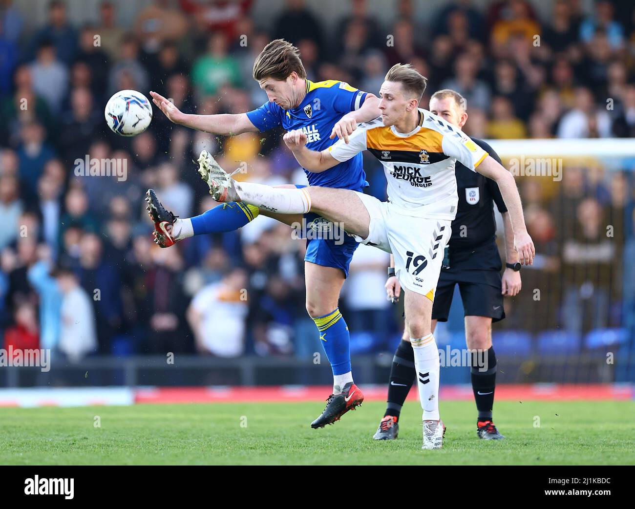 AFC Wimbledon's Alex Woodyard (left) and Cambridge United's Adam May ...
