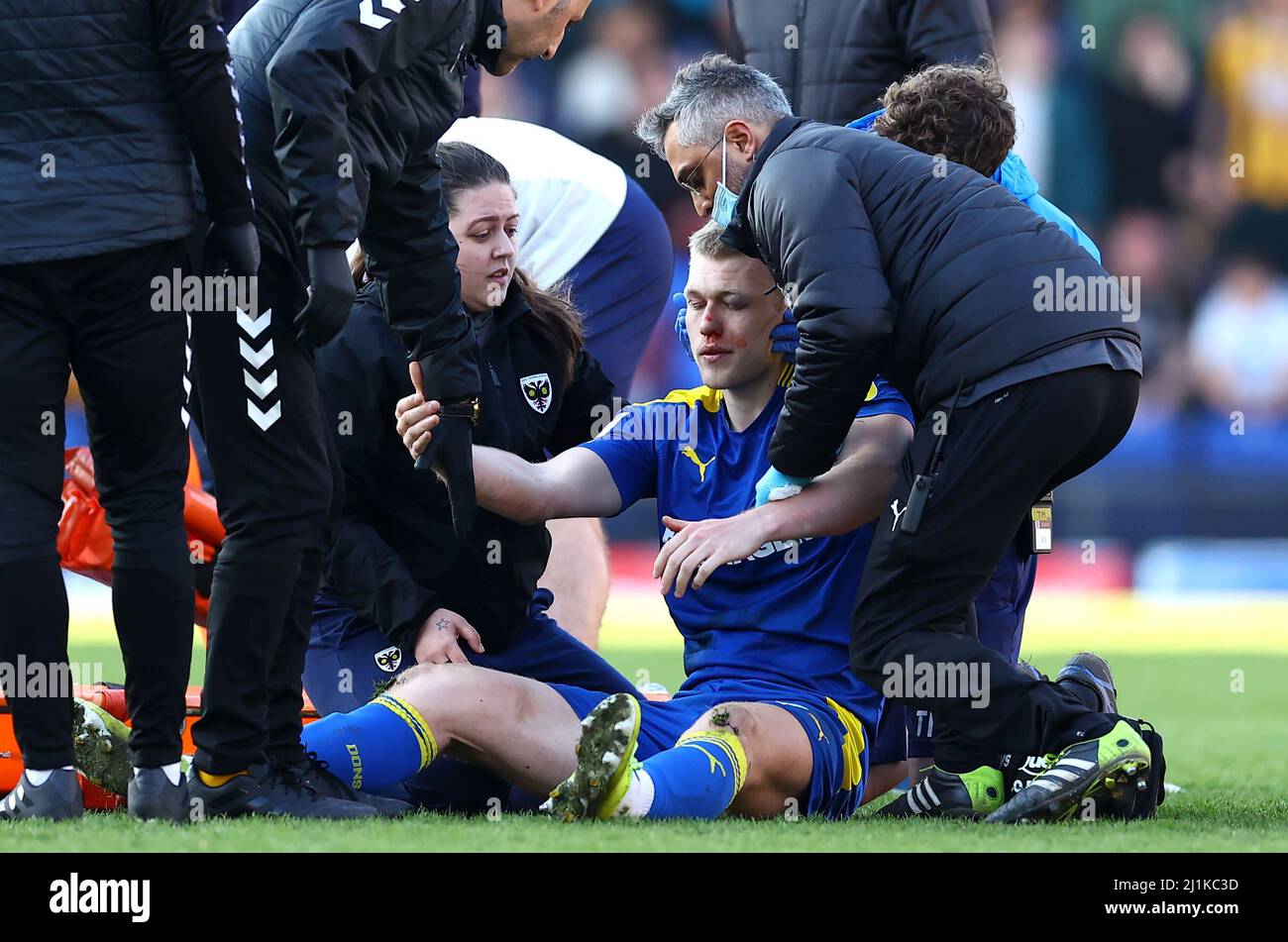 AFC Wimbledon's Sam Cosgrove receives medical treatment during the Sky ...