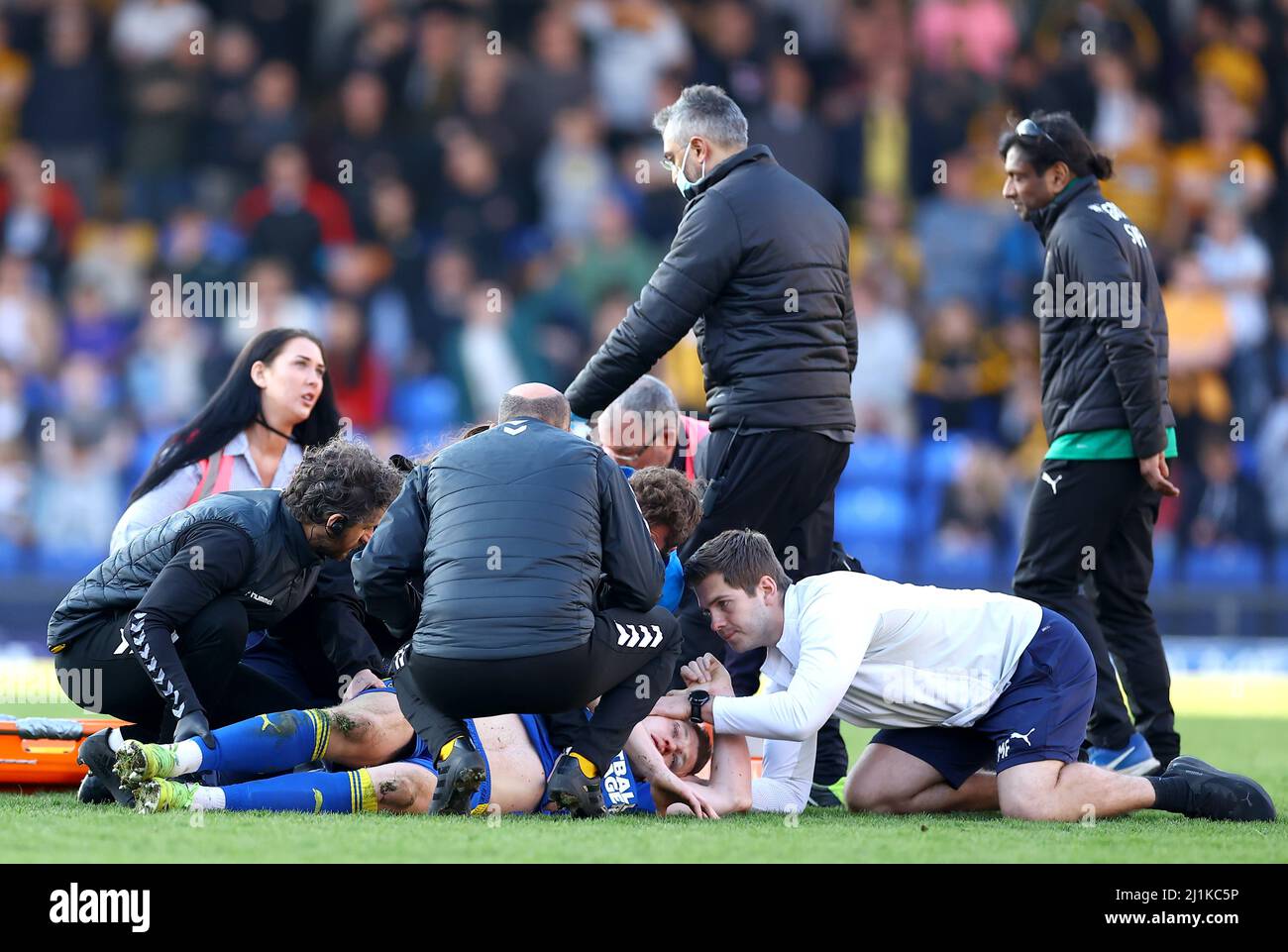 AFC Wimbledon's Sam Cosgrove receives medical treatment during the Sky ...