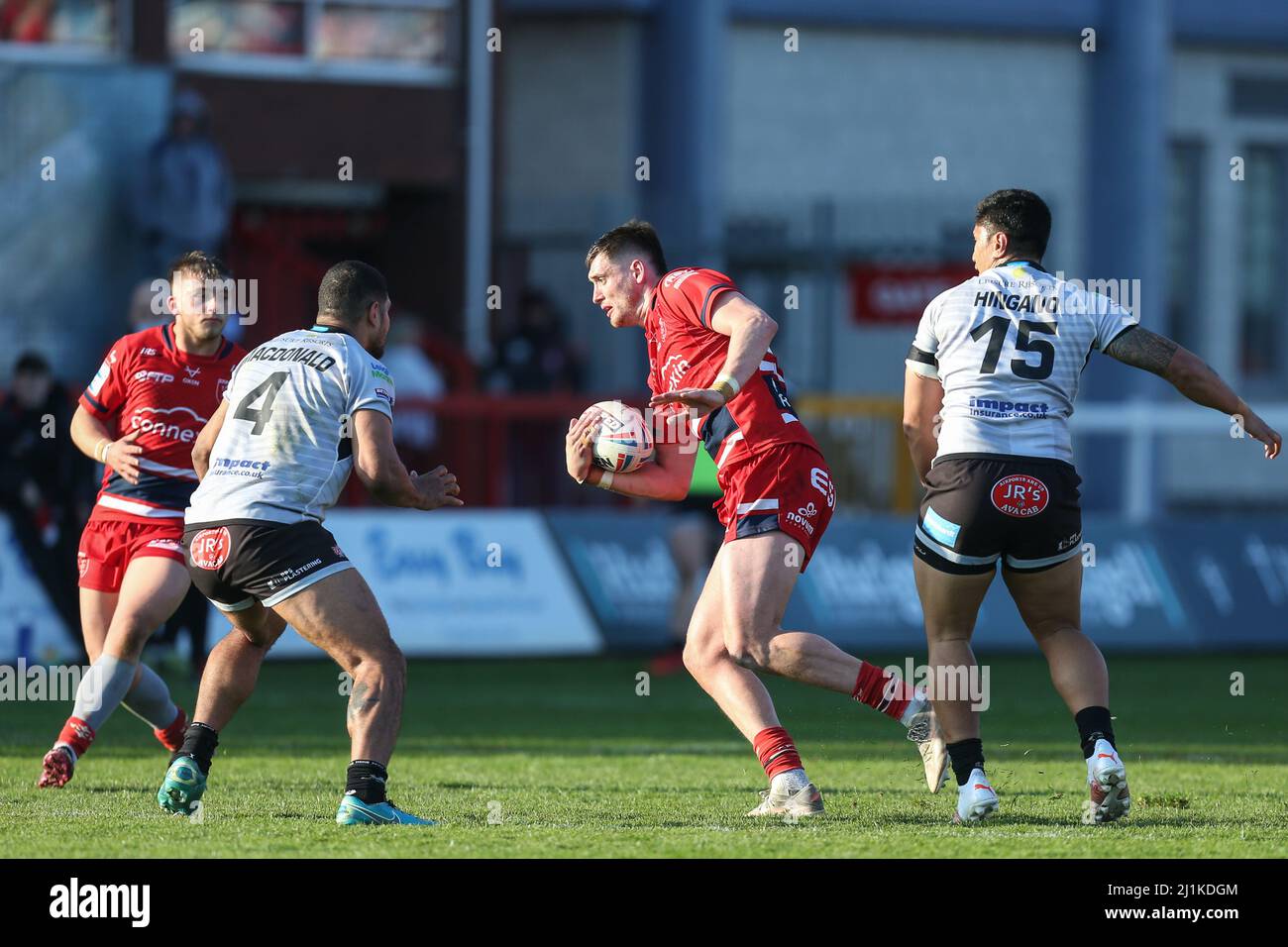 Sam Wood #24 of Hull KR runs at Nene Macdonald #4 of Leigh Centurions ...