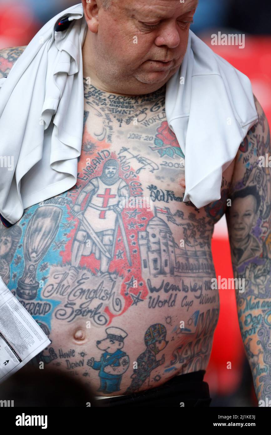 An England fan displays his tattoos before the Alzheimer's Society ...