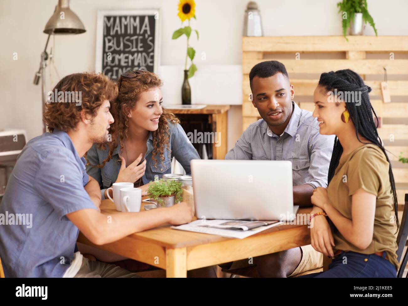 Theyre enjoying each others conversation. A group of friends sitting ...