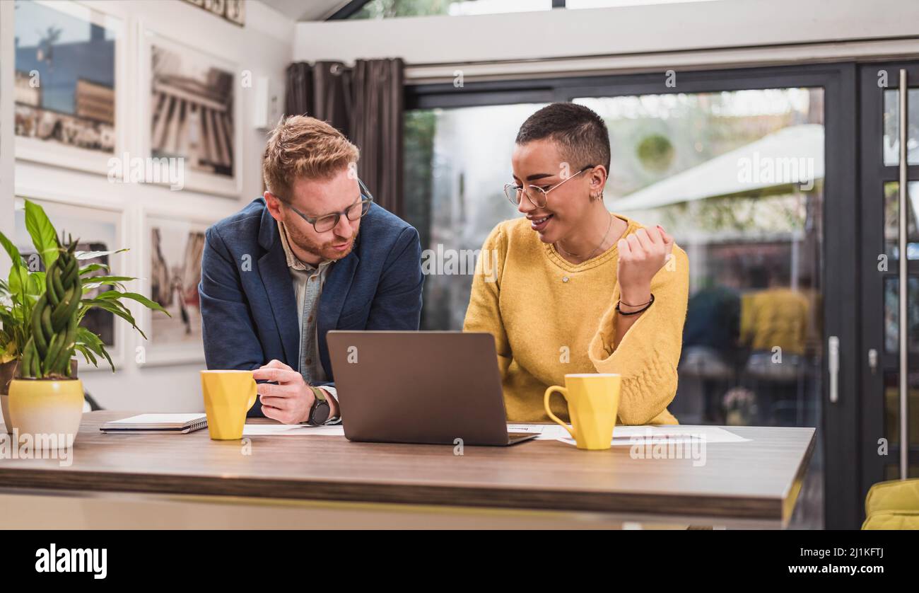 Busy work colleagues, working hard from the comfort of their home Stock ...