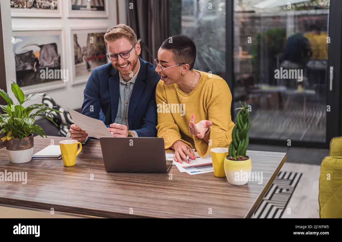 Happy employees looking online hi-res stock photography and images - Alamy