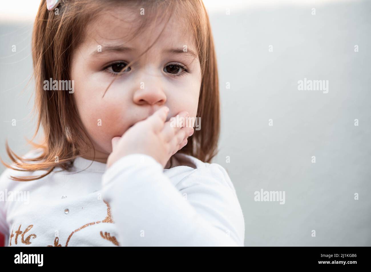 Little girl looking at something hi-res stock photography and images ...