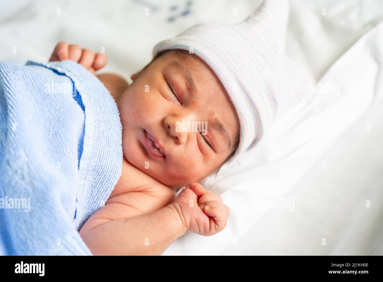 A photo of a newborn boy in the hospital, first day of life Stock Photo ...
