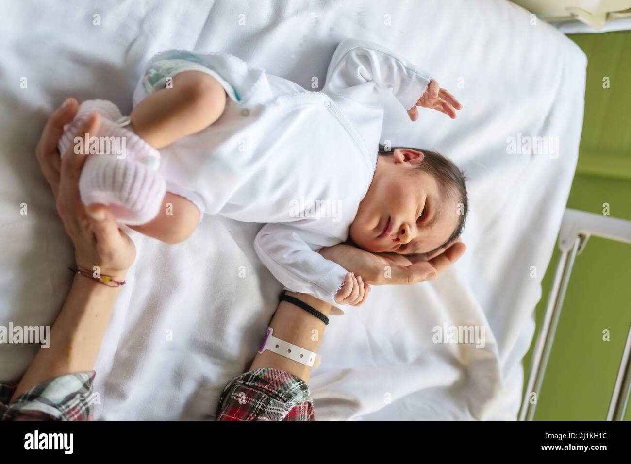 A photo of a newborn boy in the hospital, first day of life, with a ...