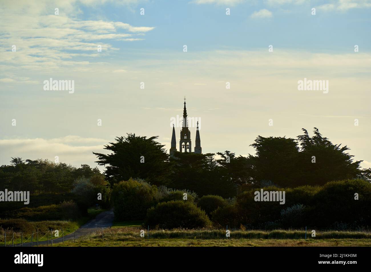 Calvary Church in France. Religious building with 3 spires silhouetted ...