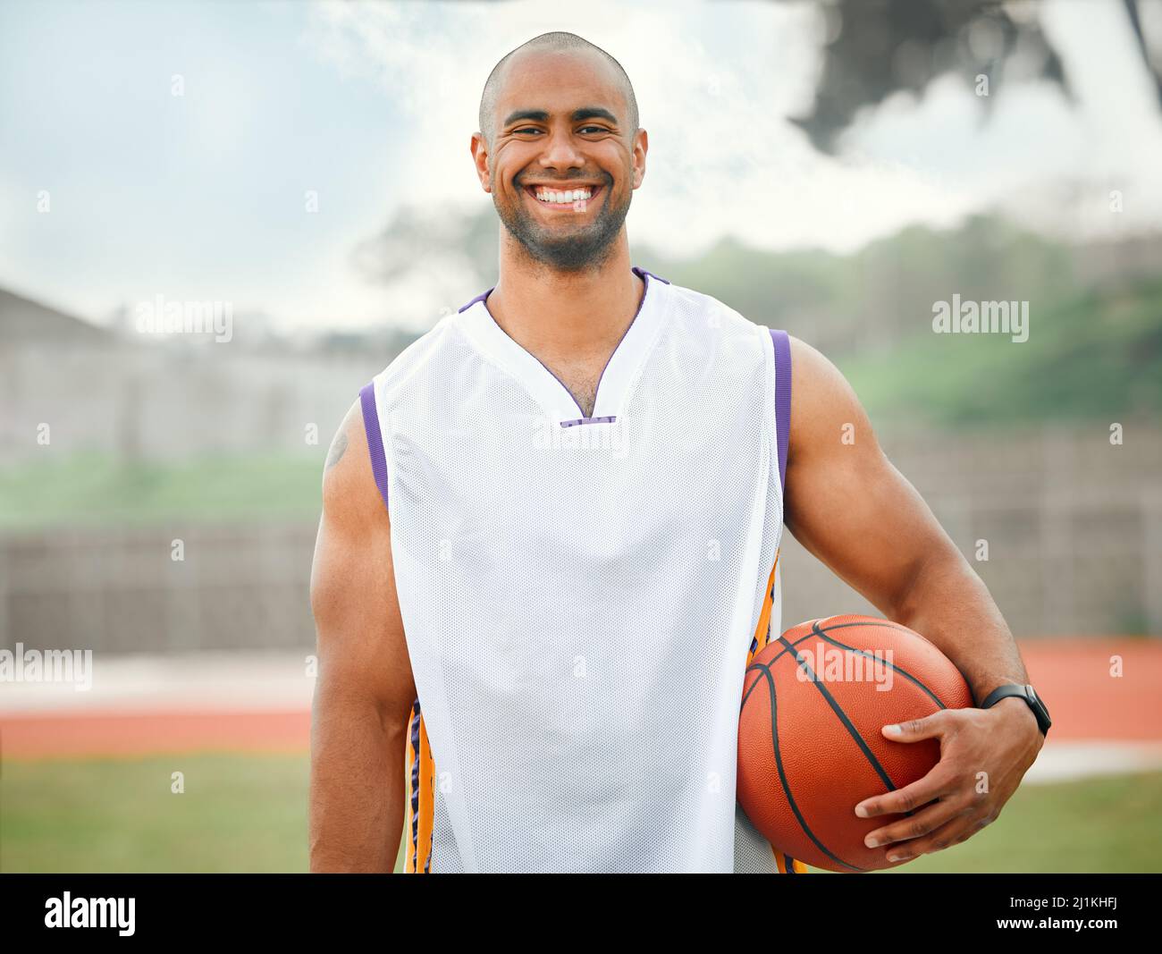 Wanna ball. Cropped portrait of a handsome young male basketball player ...