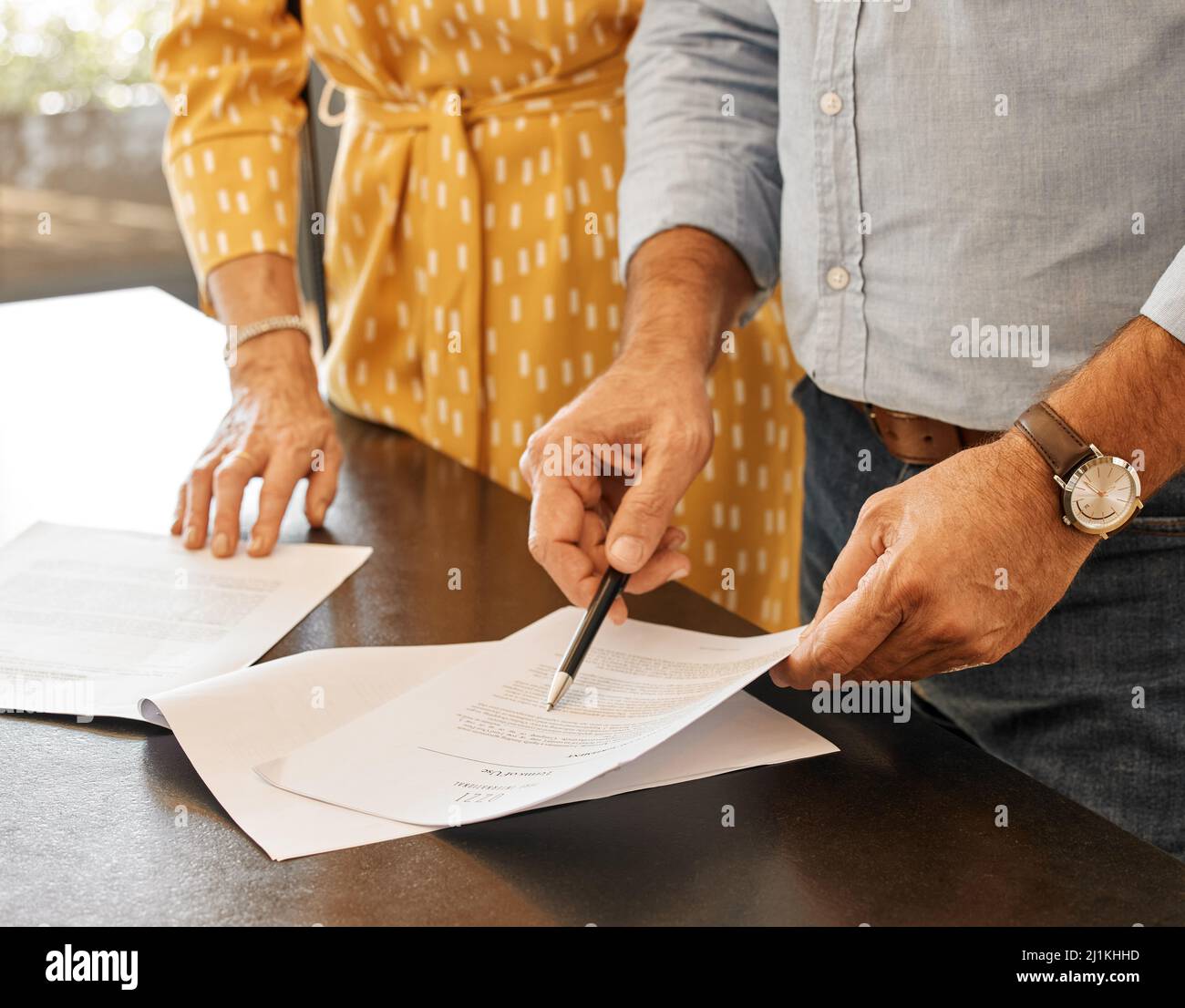 Theres a lot of paperwork. Shot of two unrecognizable people going ...