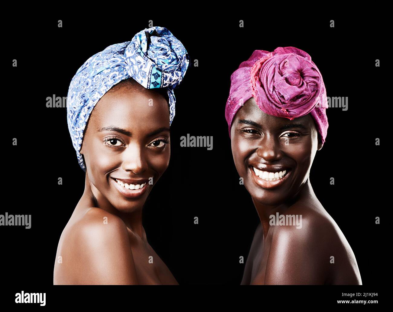 Looking stunning in their scarves. Studio portrait of two beautiful ...
