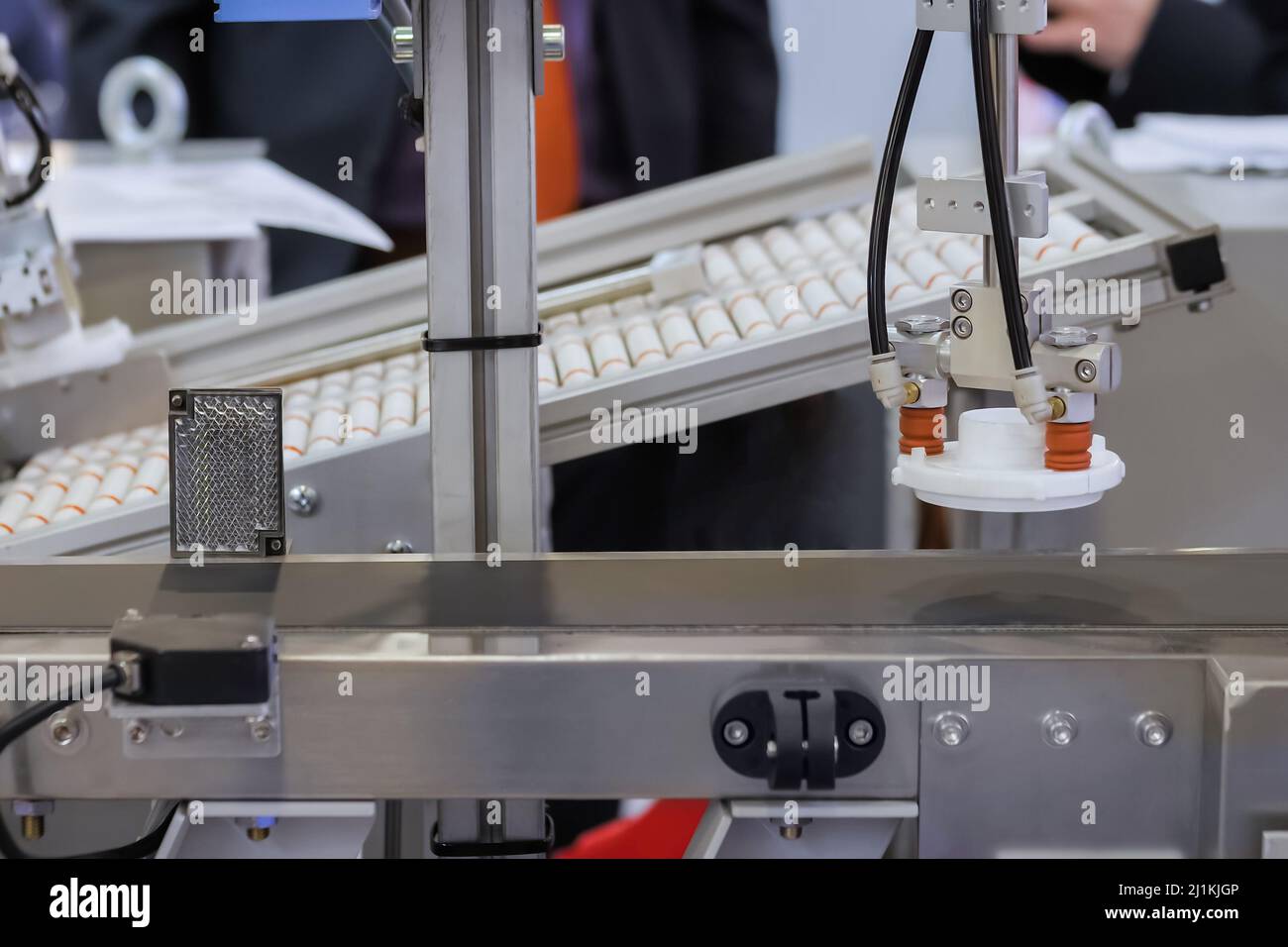 Pick and place robotic arm manipulator moving plastic detail on ...