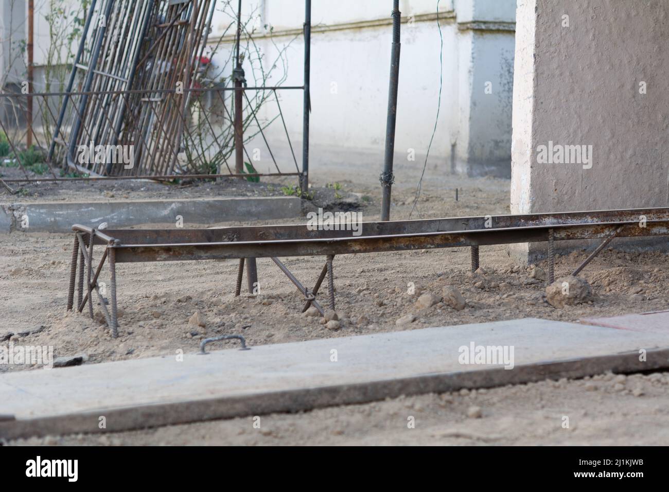 Foundation blind area preparing. Sand along the base of the house ...