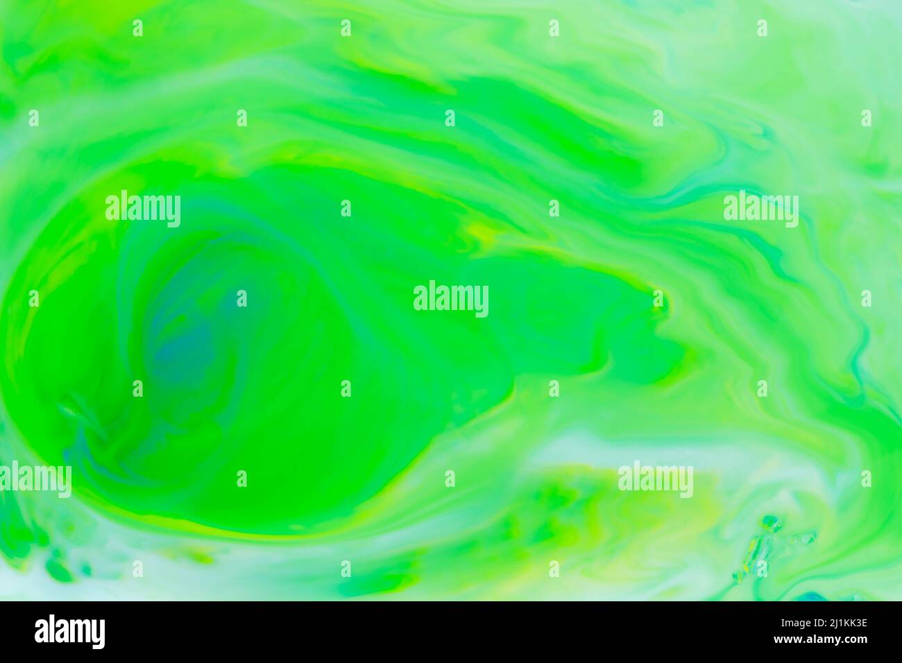 Fluid art background in green color. Green-turquoise stains on liquid ...