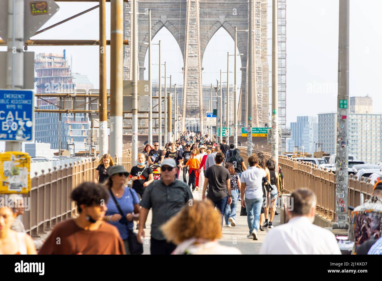 A crowd of people is back in Brooklyn Bridge during evening commute NYC ...