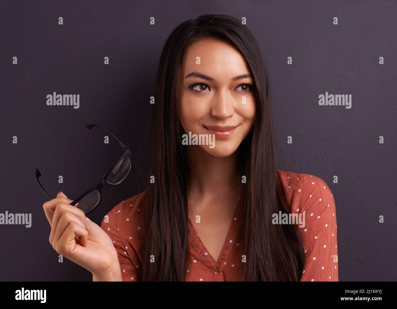 Shes got your attention. A pretty young woman looking at the camera ...