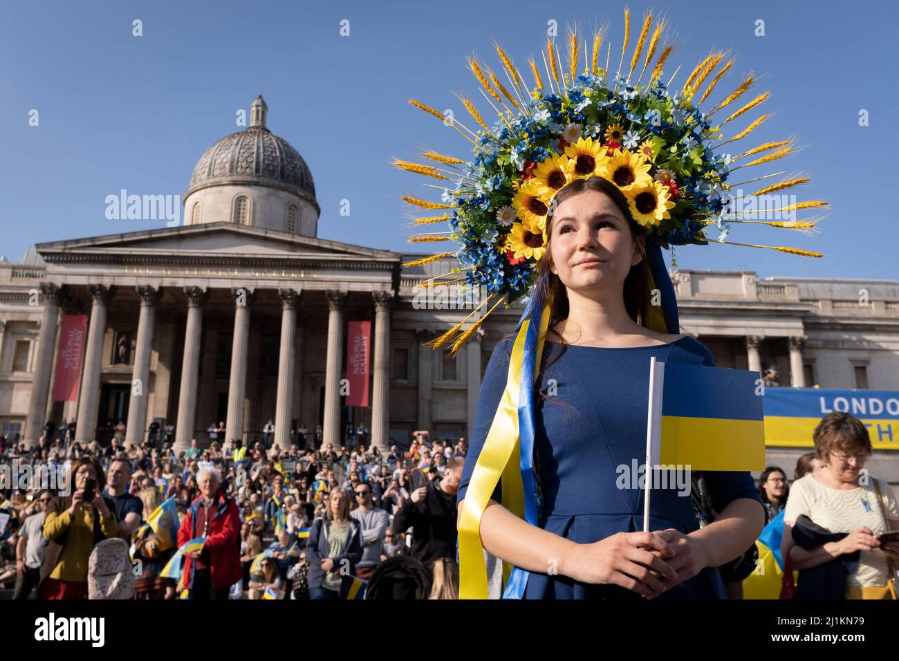 A Ukrainian woman stands in Trafalgar Square during the protest in ...