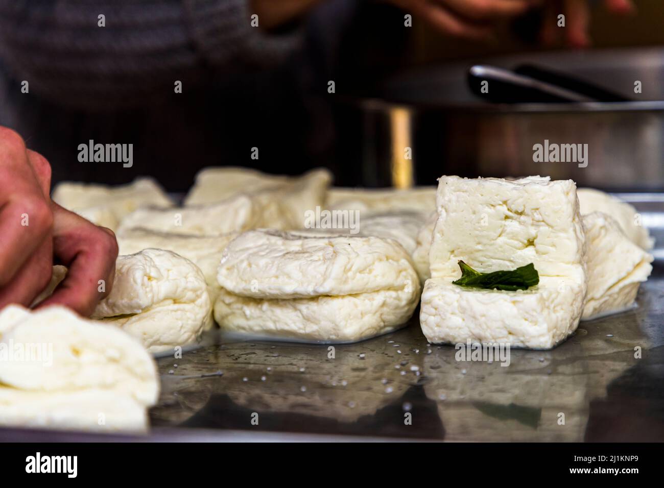 Hellim or Halloumi gets its typical angular shape because the liquid ...