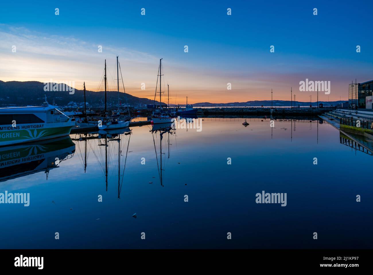 TRONDHEIM, NORWAY - MARCH 08, 2022: Evening view of Trondheim harbour ...