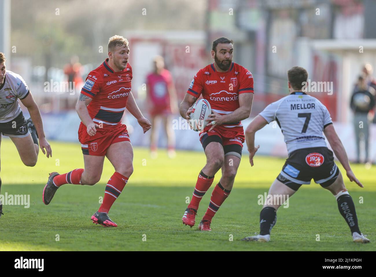 Kane Linnett #12 of Hull KR runs at Joe Mellor #7 of Leigh Centurions ...