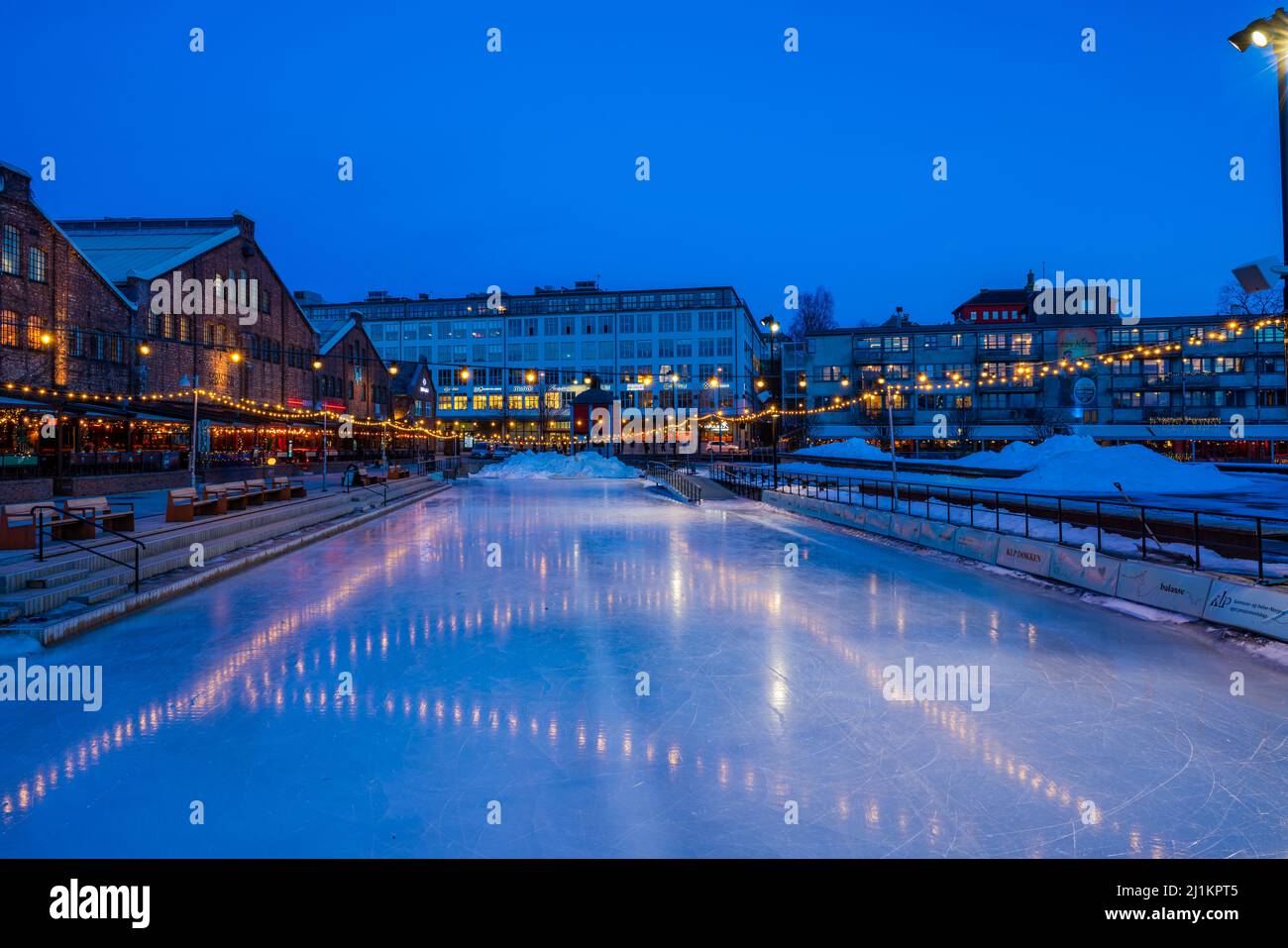 TRONDHEIM, NORWAY - MARCH 09, 2022: Evening view of outdoor ice skating ...
