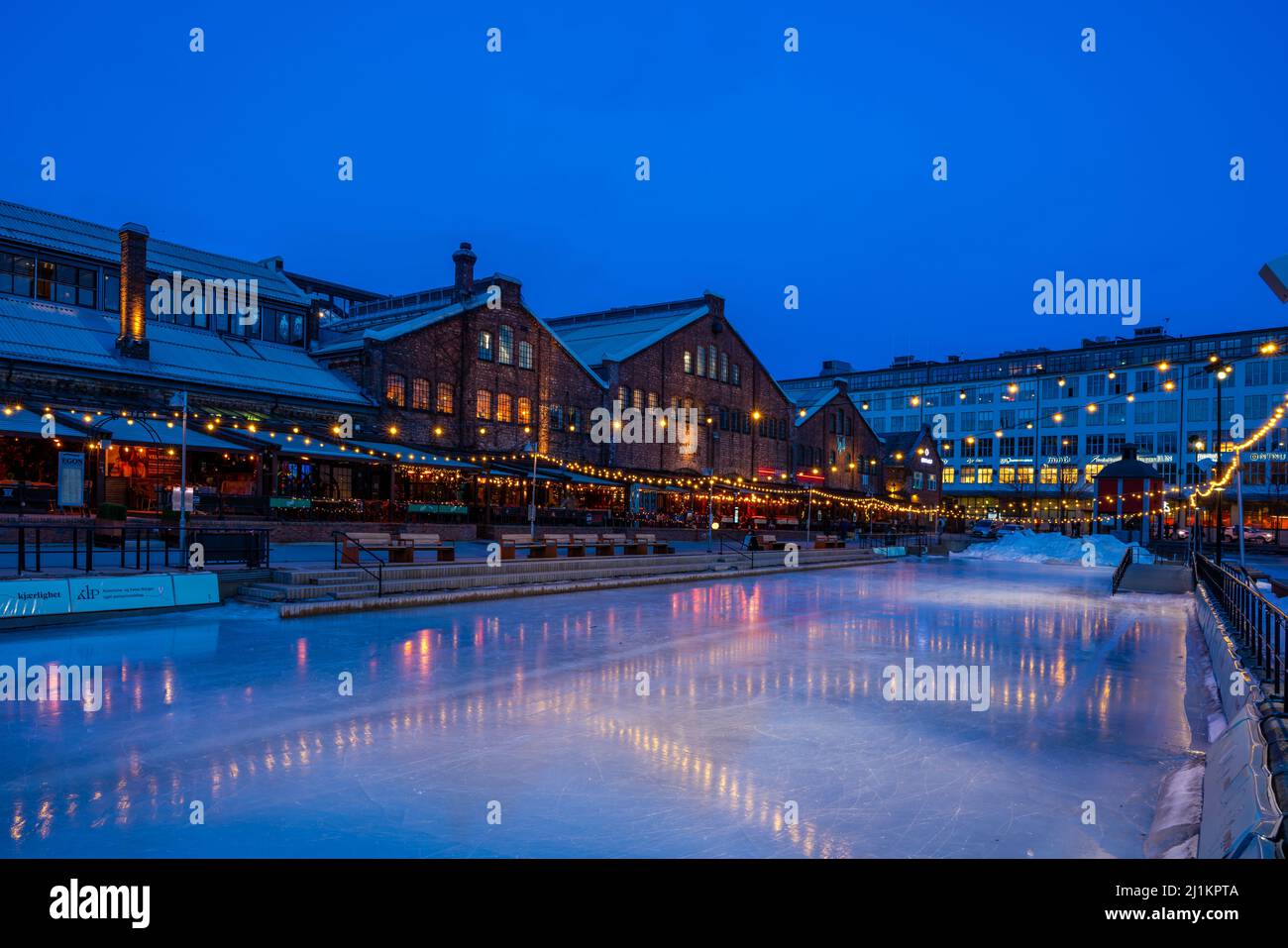 TRONDHEIM, NORWAY - MARCH 09, 2022: Evening view of outdoor ice skating ...