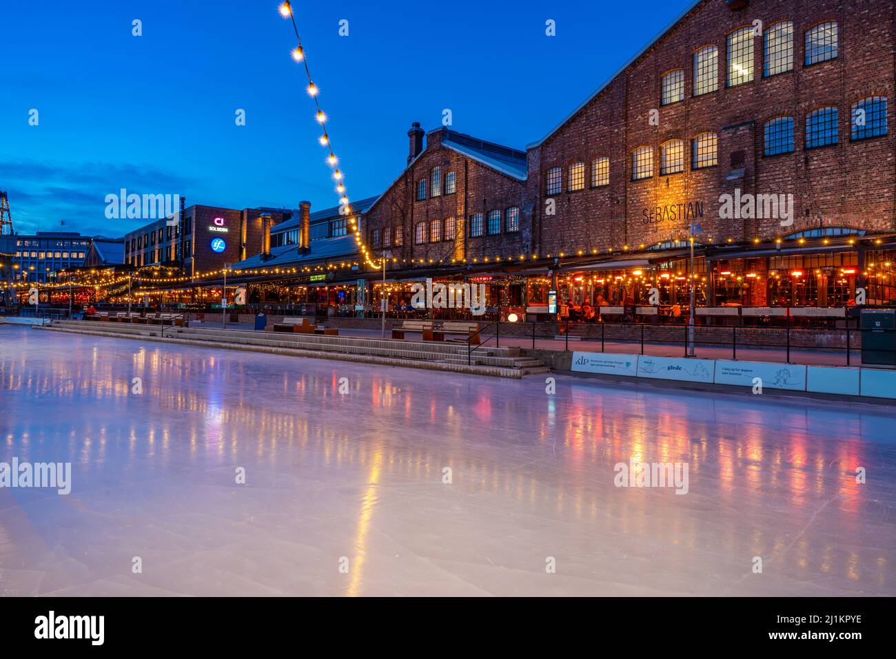 TRONDHEIM, NORWAY - MARCH 09, 2022: Evening view of outdoor ice skating ...