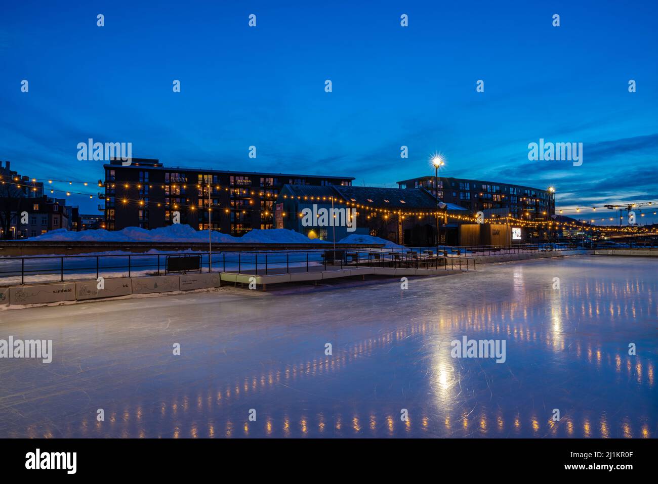 TRONDHEIM, NORWAY - MARCH 09, 2022: Evening view of outdoor ice skating ...