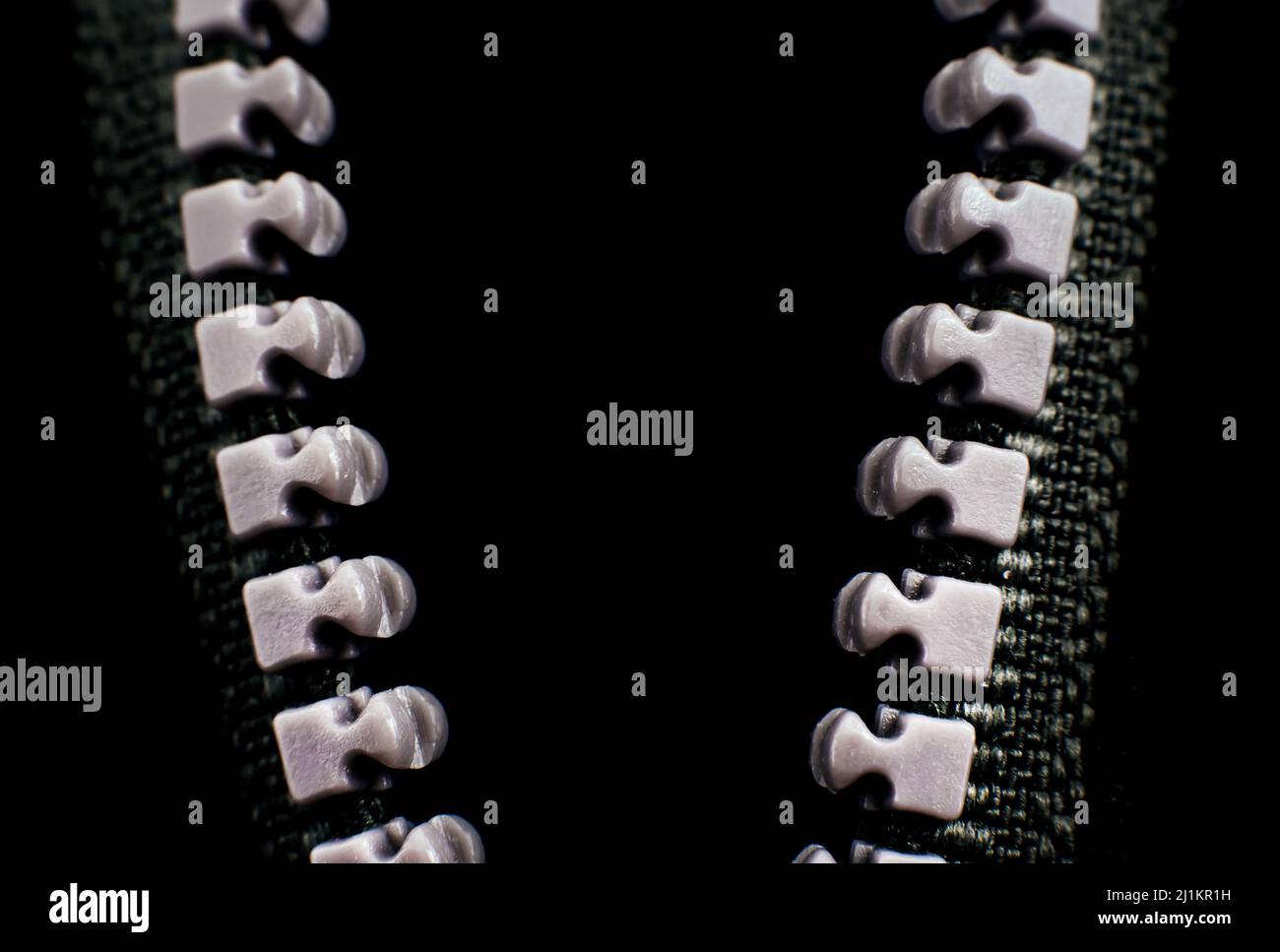 Lock with a gray zipper on black clothes close-up. Jacket clasp Stock ...