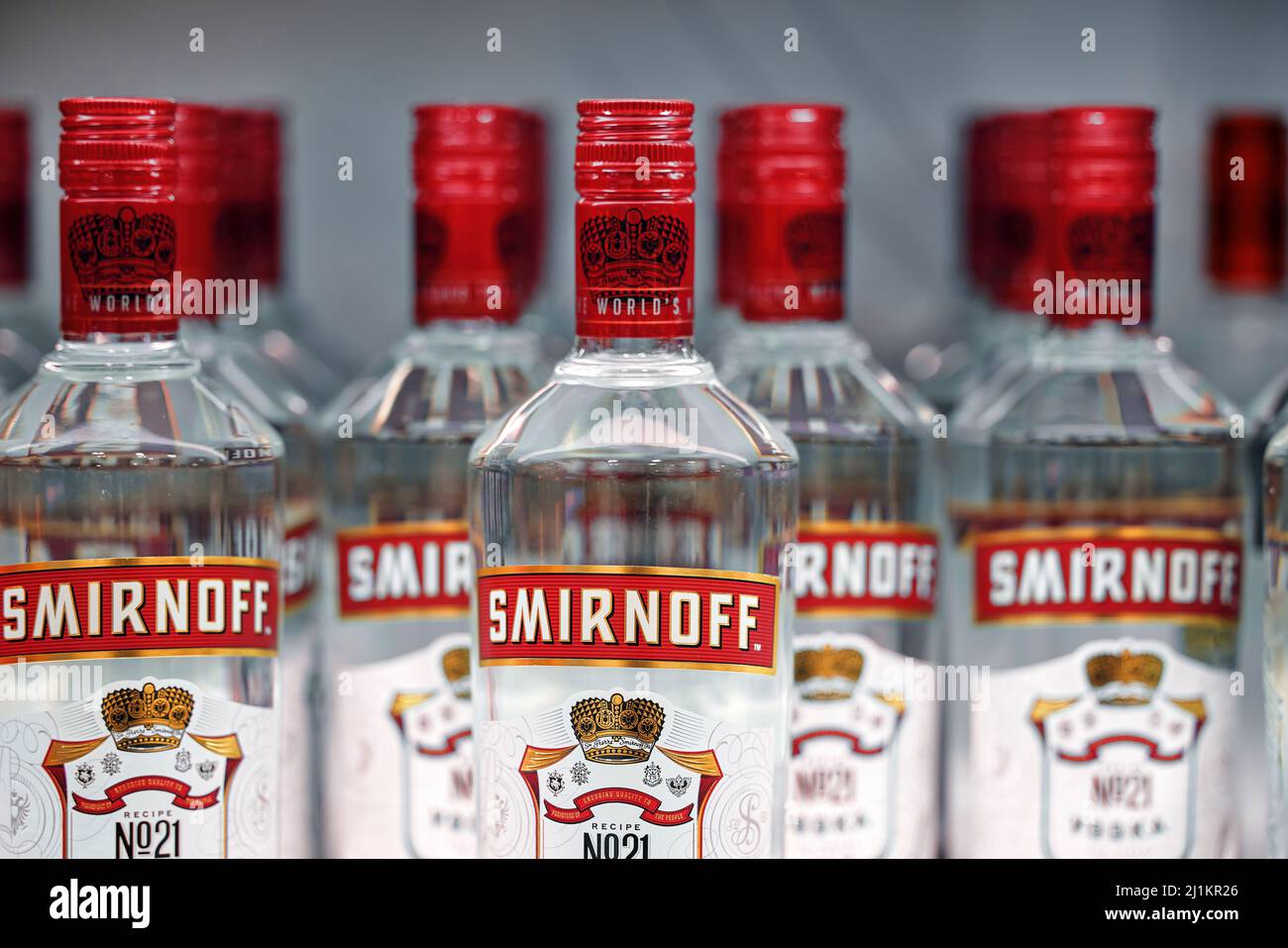 Russian vodka. Bottles of Smirnoff vodka on a shelf in duty free shop ...