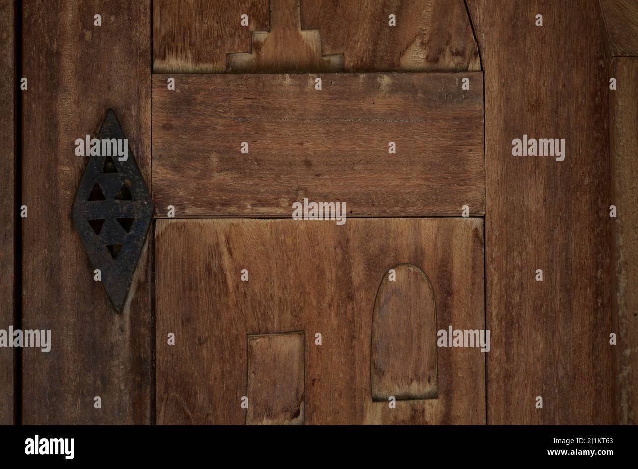 Antique solid oak wooden door with a rusty metal keyhole of Aghia ...