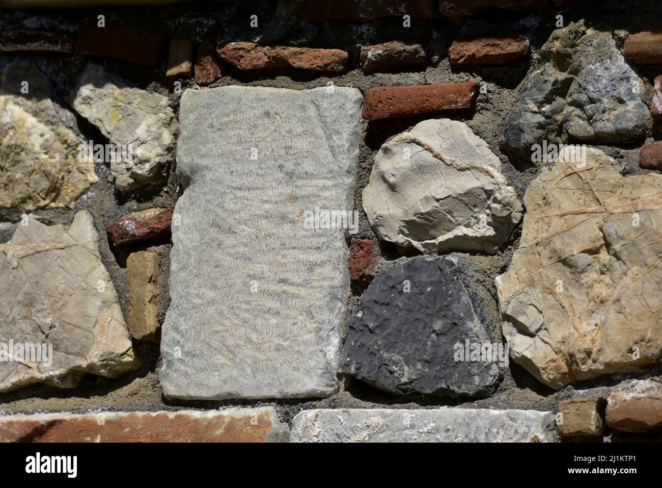 Stone and marble wall of Aghia Fotini a peculiar Christian church with ...