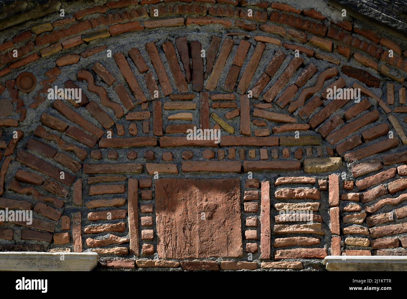 Stone and brick wall of Aghia Fotini a peculiar Christian church with ...
