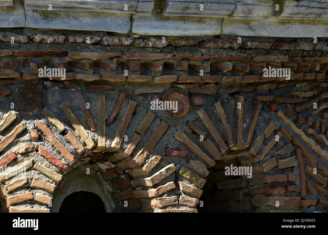Stone and brick wall of Aghia Fotini a peculiar Christian church with ...