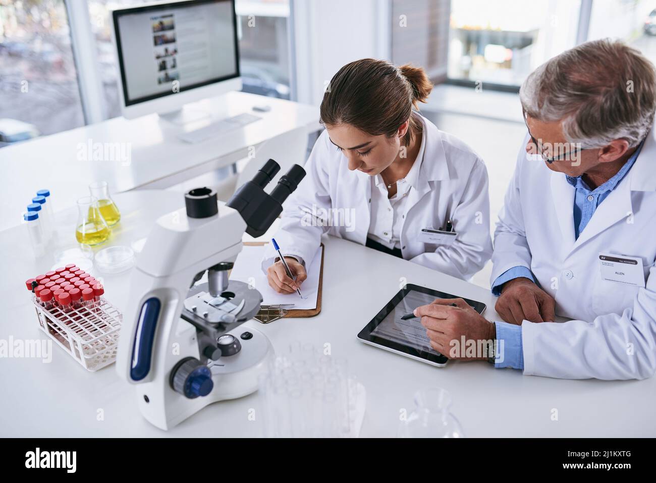 Making a full detailed analysis of their latest findings. Shot of two ...