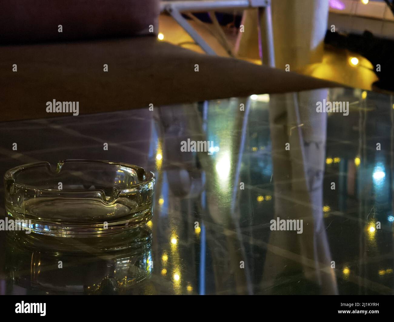 A glass ashtray on a table in a bar Stock Photo - Alamy
