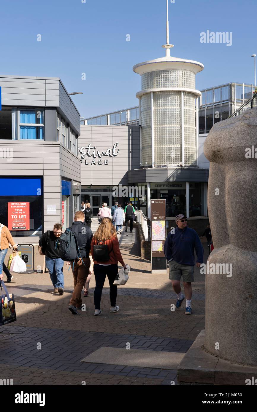 Shoppers entering and leaving Festival Place shopping centre on a sunny ...