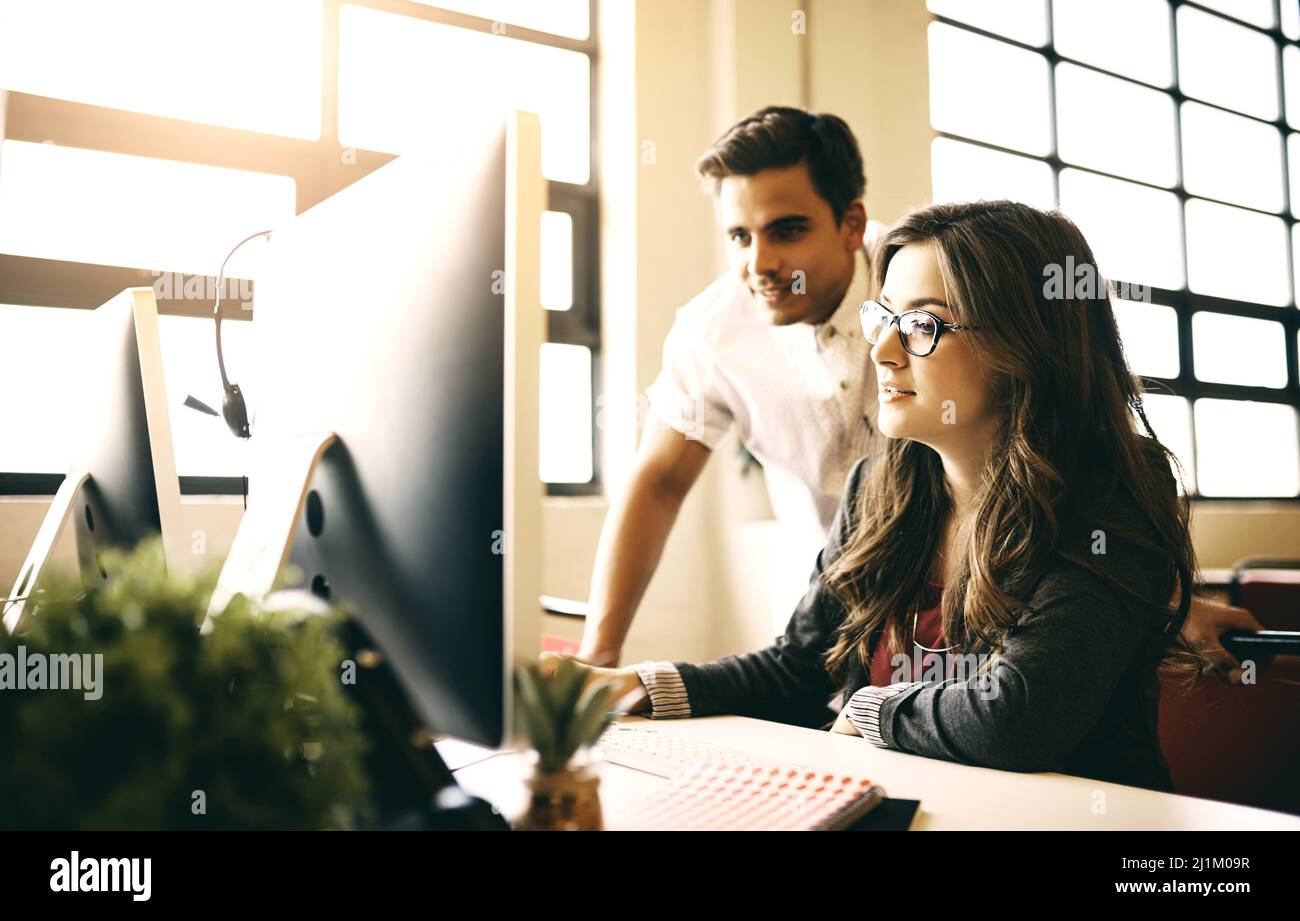 You did a really good job there. Cropped shot of colleagues discussing ...