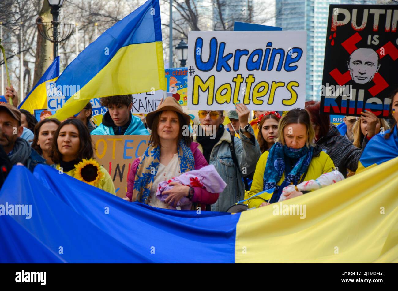 A participant is seen holding a sign that says Ukraine Matter at the ...