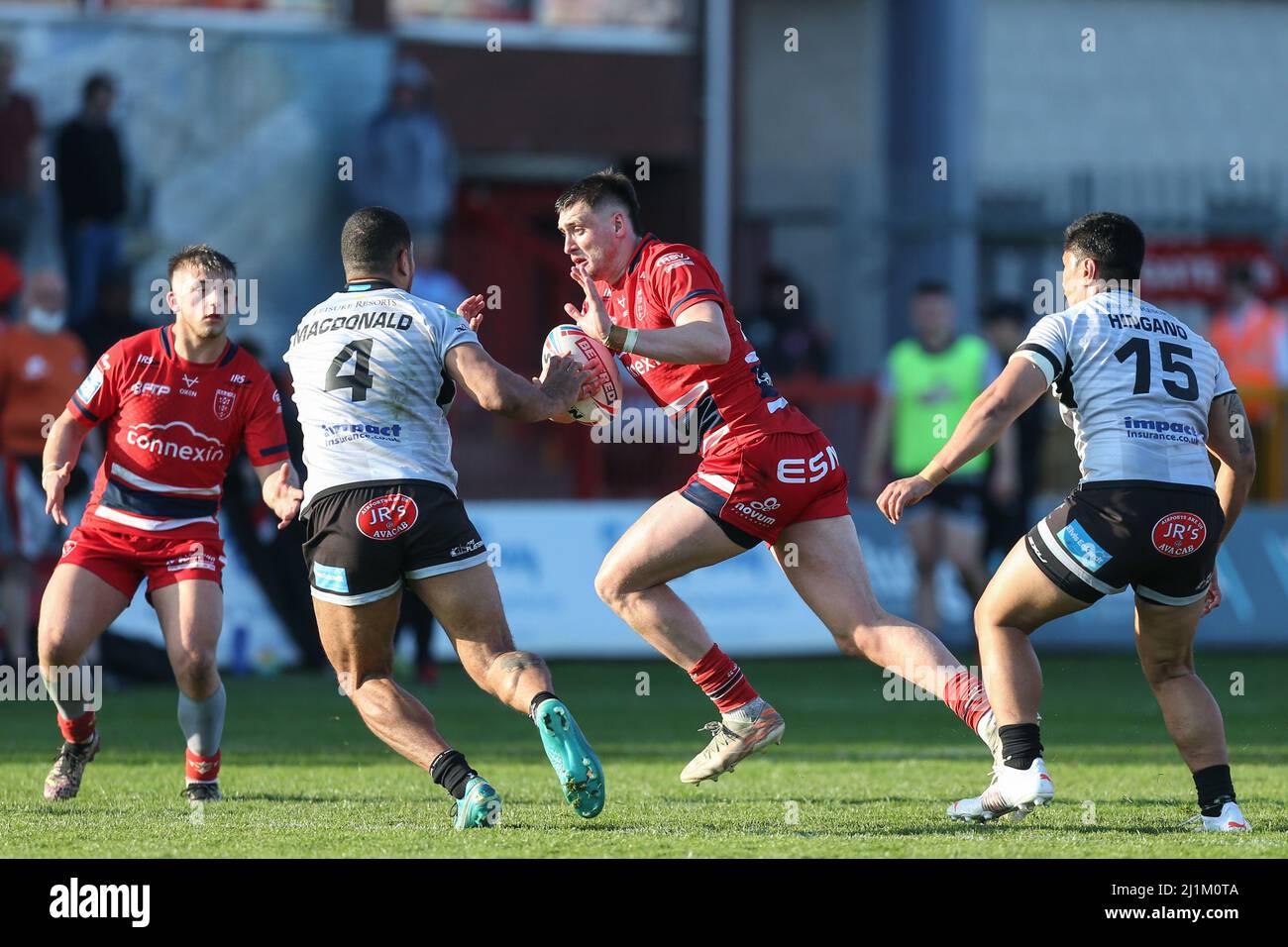 Sam Wood #24 of Hull KR looks to hold off Nene Macdonald #4 of Leigh ...