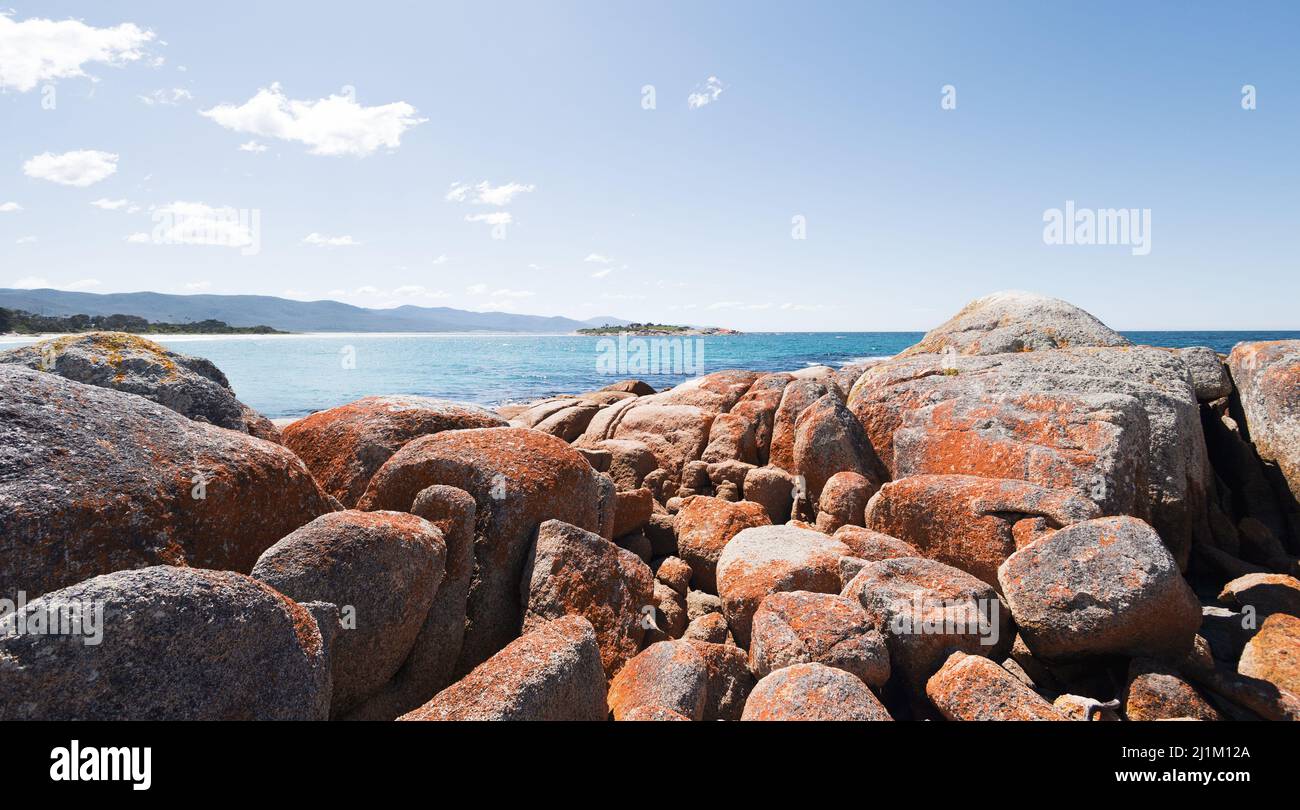 The heap of rocks on the coast against a cloudy sky Stock Photo - Alamy