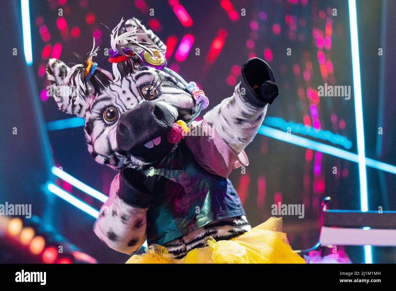 Cologne, Germany. 26th Mar, 2022. The character "The Zebra" is on stage ...