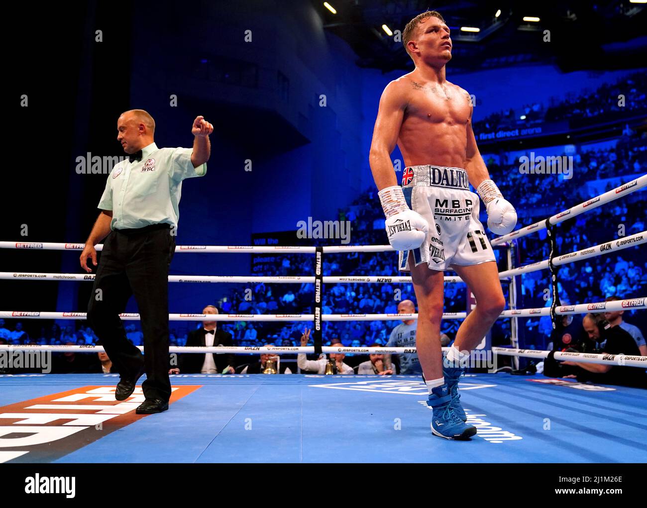 Dalton Smith returns to his corner after knocking down Ray Moylette ...