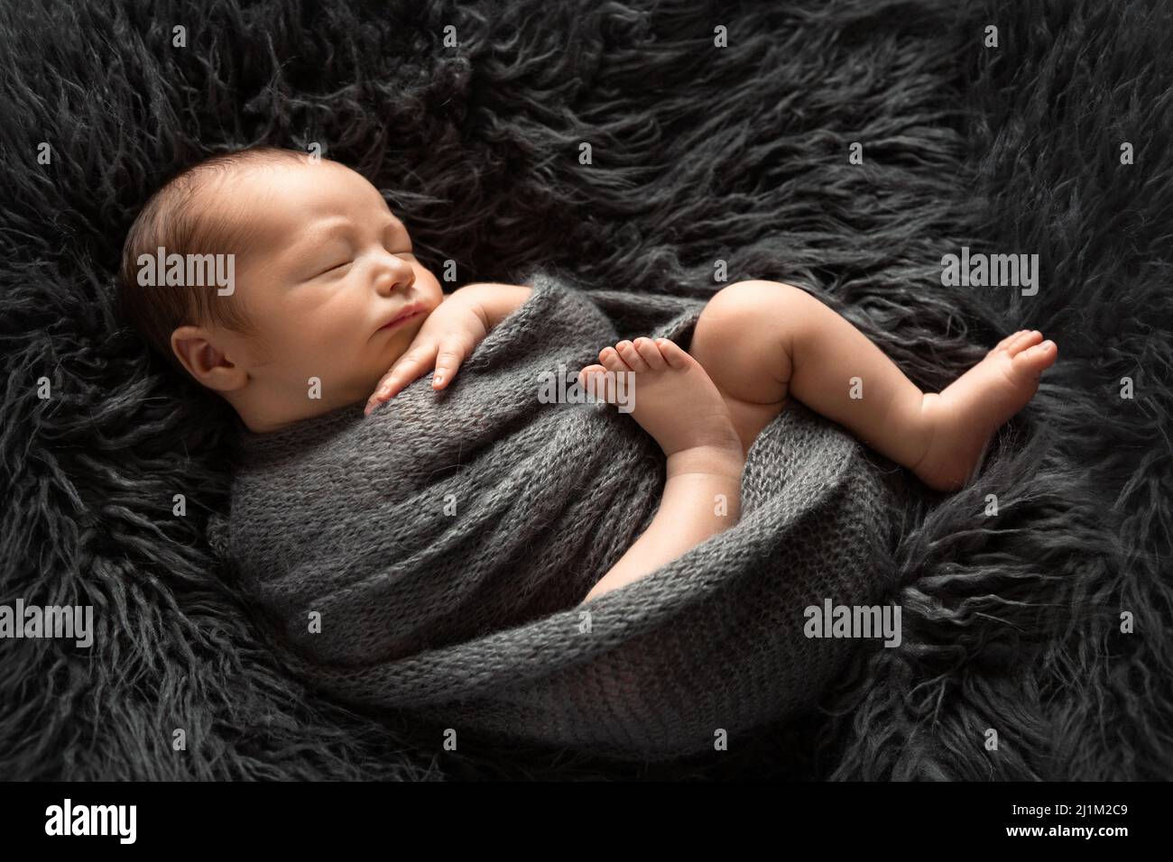 Infant swaddled hi-res stock photography and images - Alamy