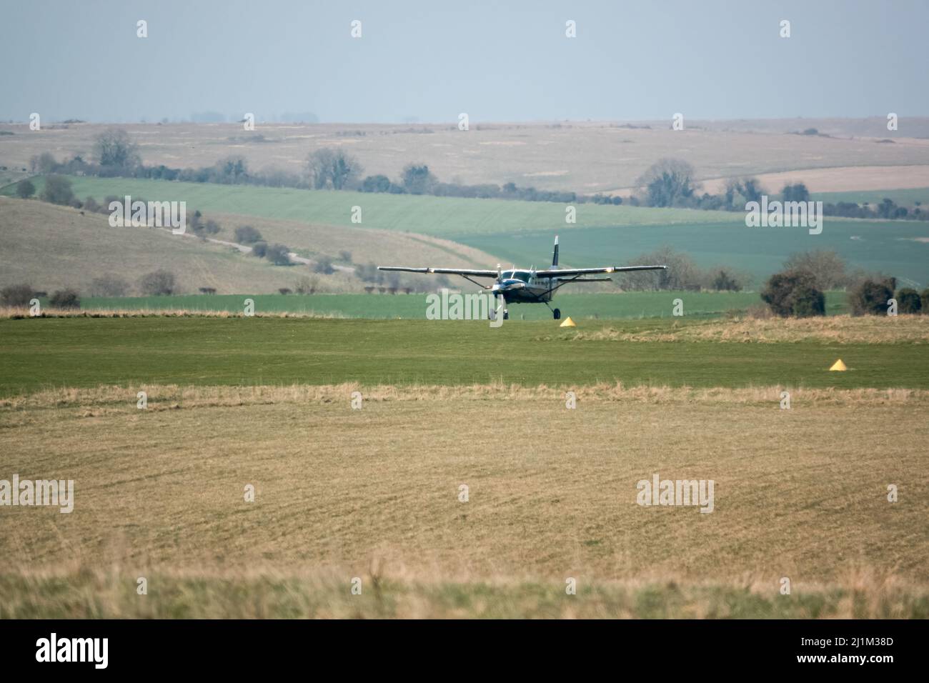 Cessna 208b Grand Caravan G-BZAH light aircraft descends to land and ...